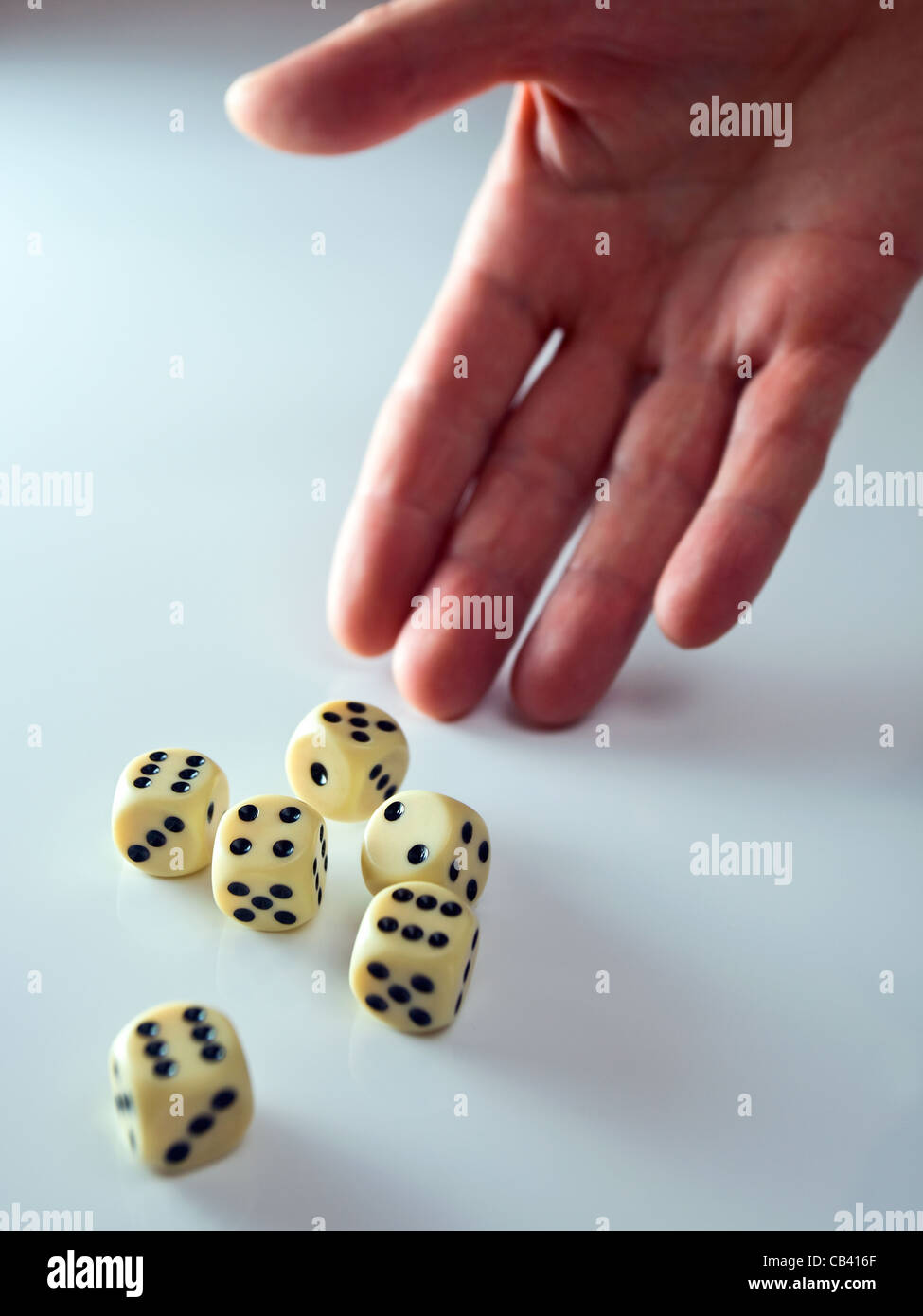 The hand of the person throwing cubes for dicing Stock Photo - Alamy