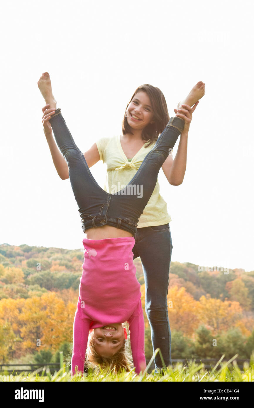 Kids doing handstand hi-res stock photography and images - Alamy