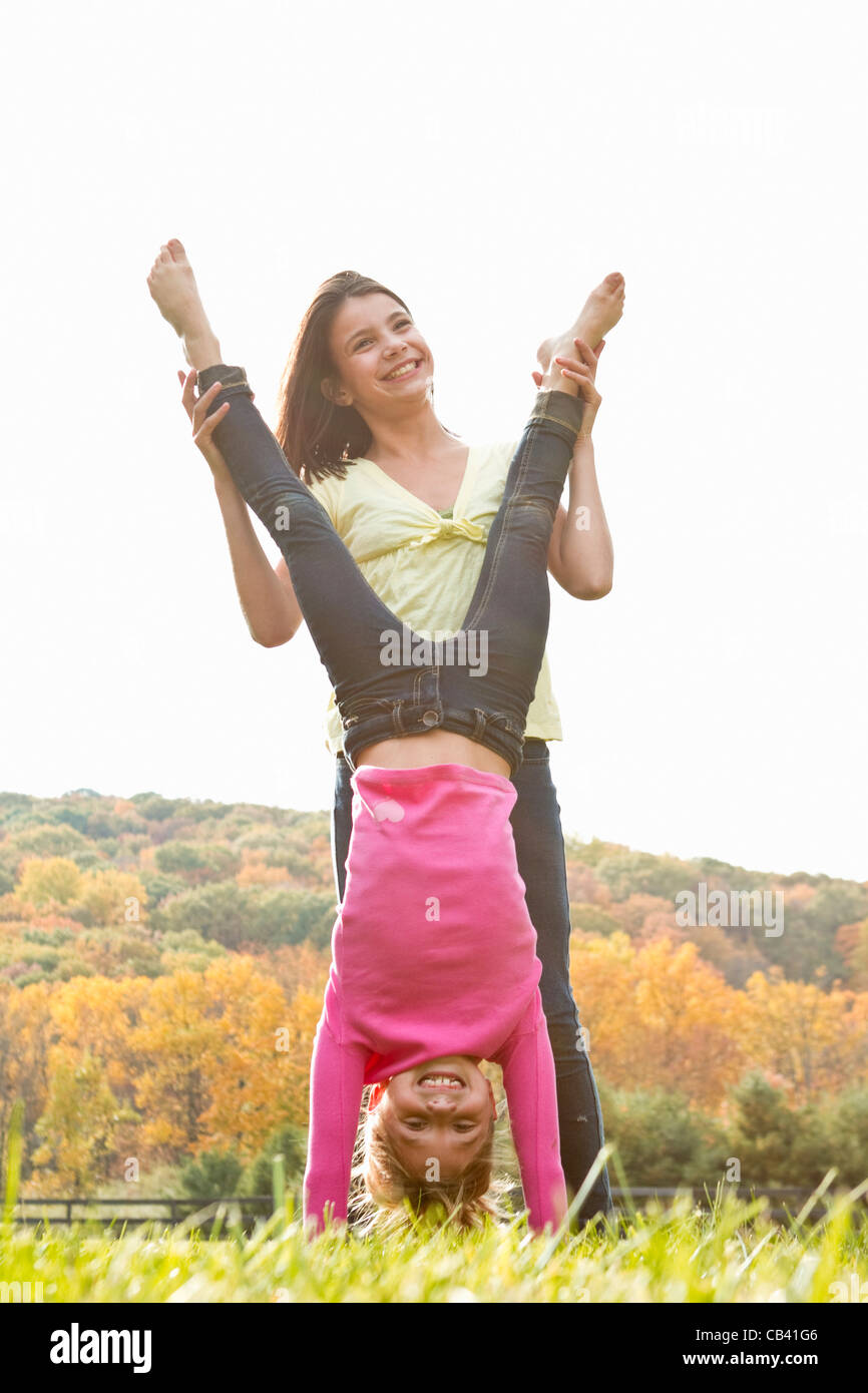 Kids doing handstand hi-res stock photography and images - Alamy