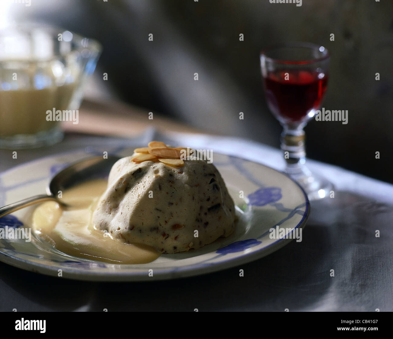 Tutti - Frutti - pudding with vanilla - sauce Stock Photo - Alamy