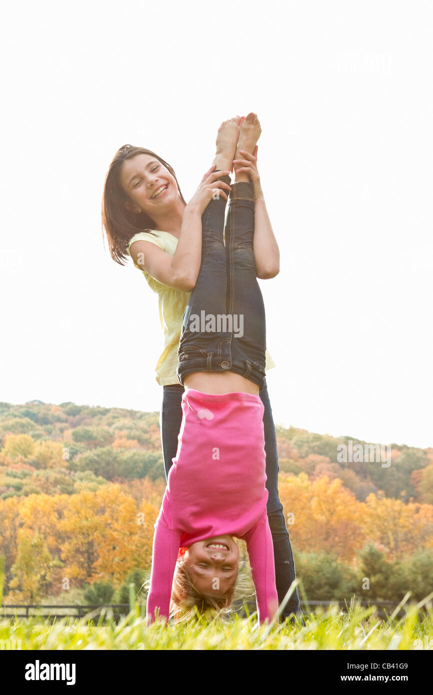 Kids doing handstand hi-res stock photography and images - Alamy
