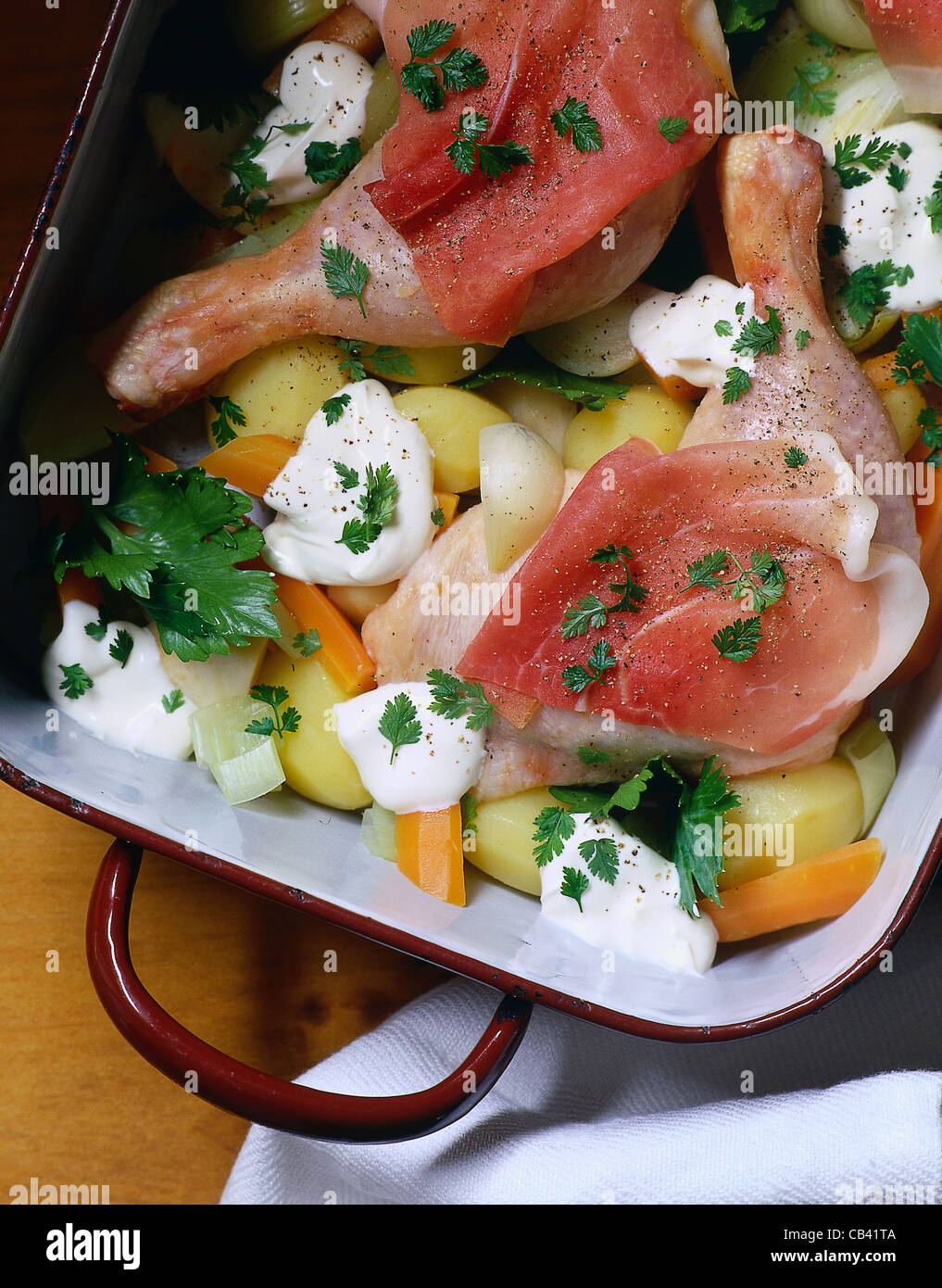 Still: Haunch of chicken with parma ham and vegetables (raw Stock Photo ...