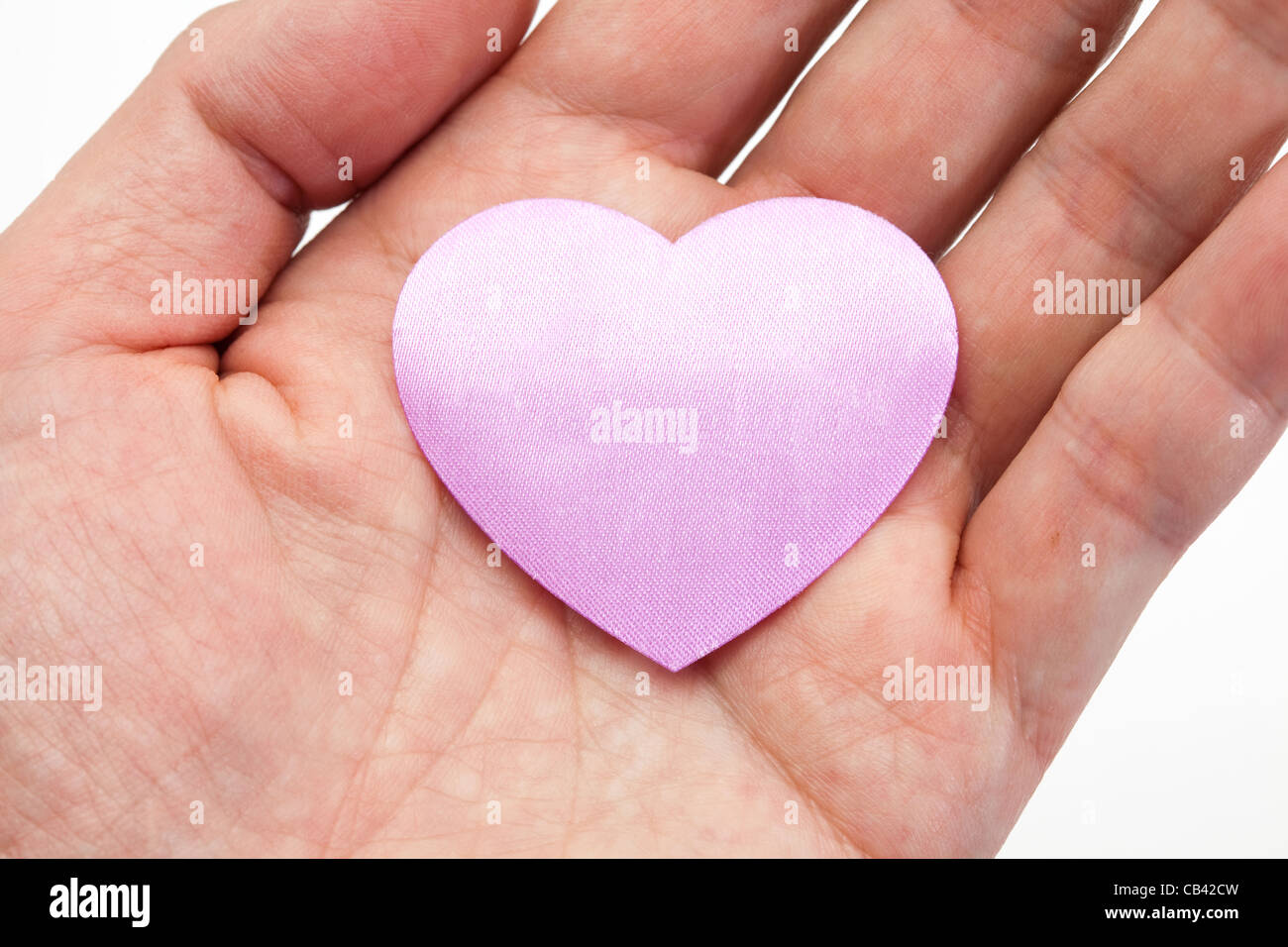 hand holding a Pink heart, love concept Stock Photo - Alamy