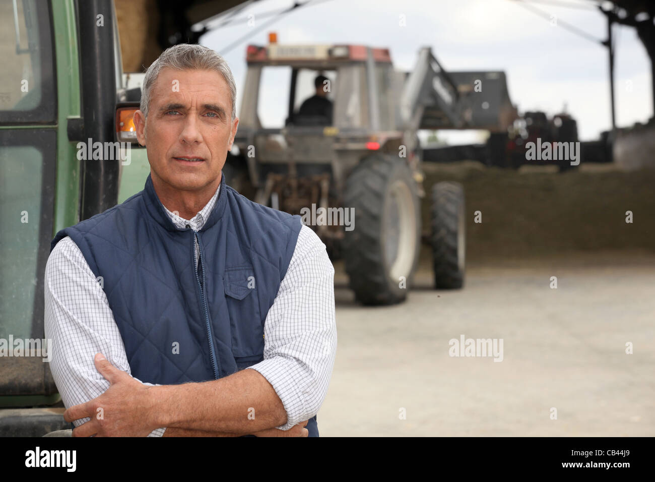 farmers working with their tractors Stock Photo - Alamy