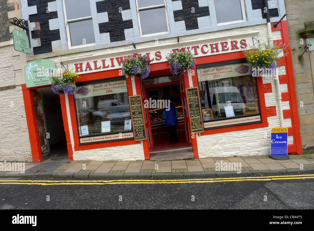 A tilted camera view of a butcher shop on a hill in the town of Selkirk ...