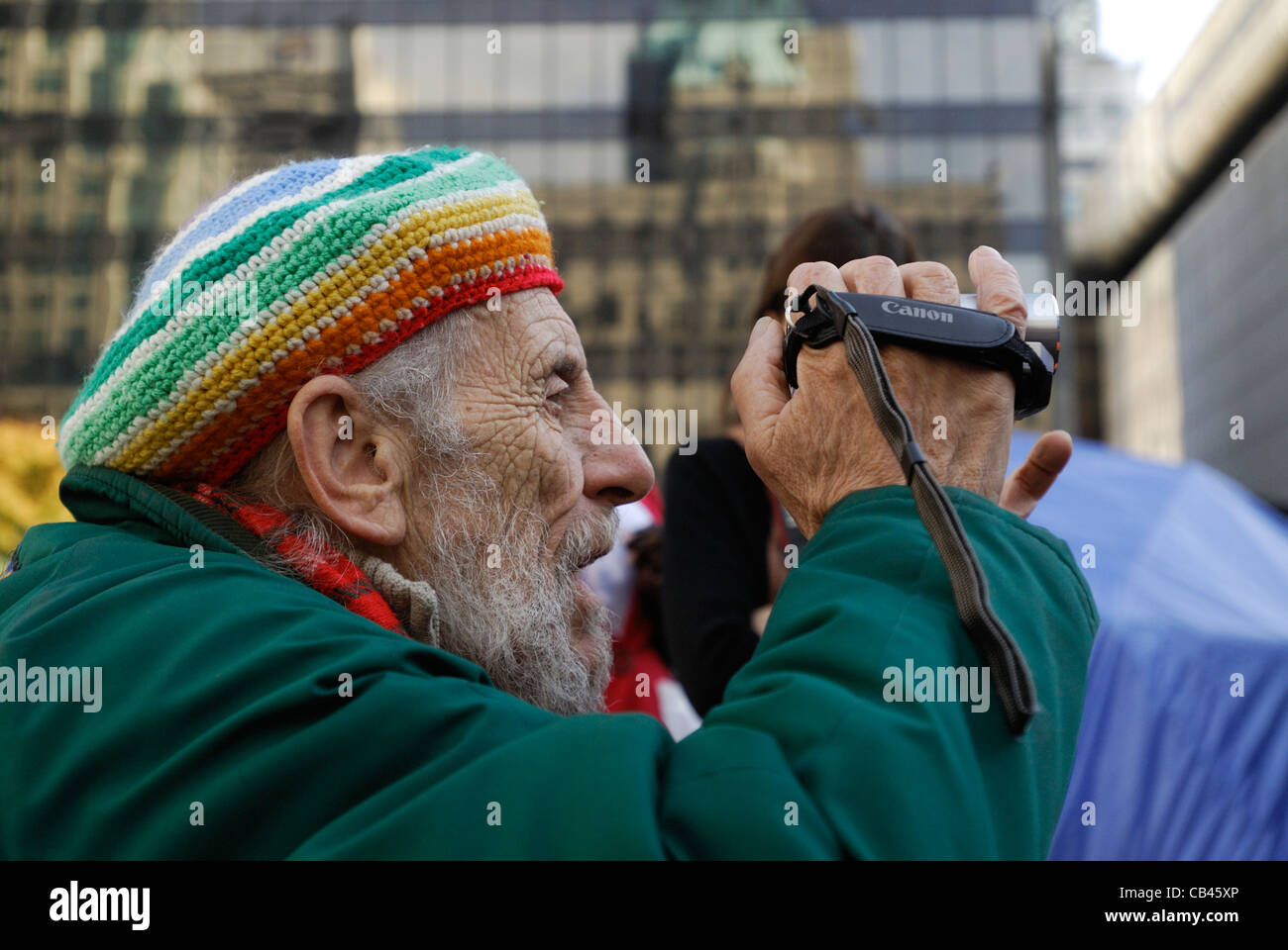 Elderly man with a video camera Stock Photo - Alamy