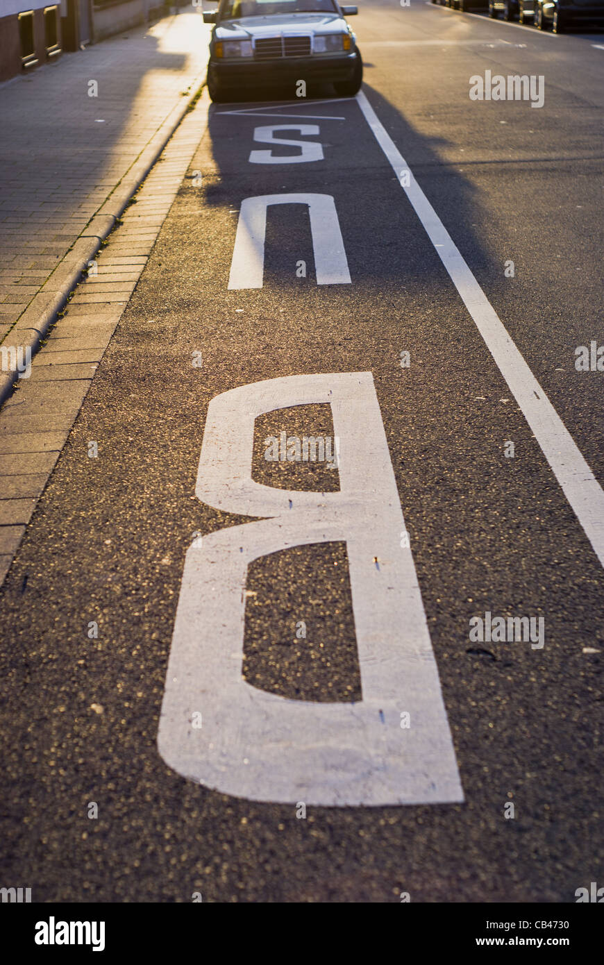 Bus Stop in the Morning. Huge Letters. Bus stop sign written on road ...