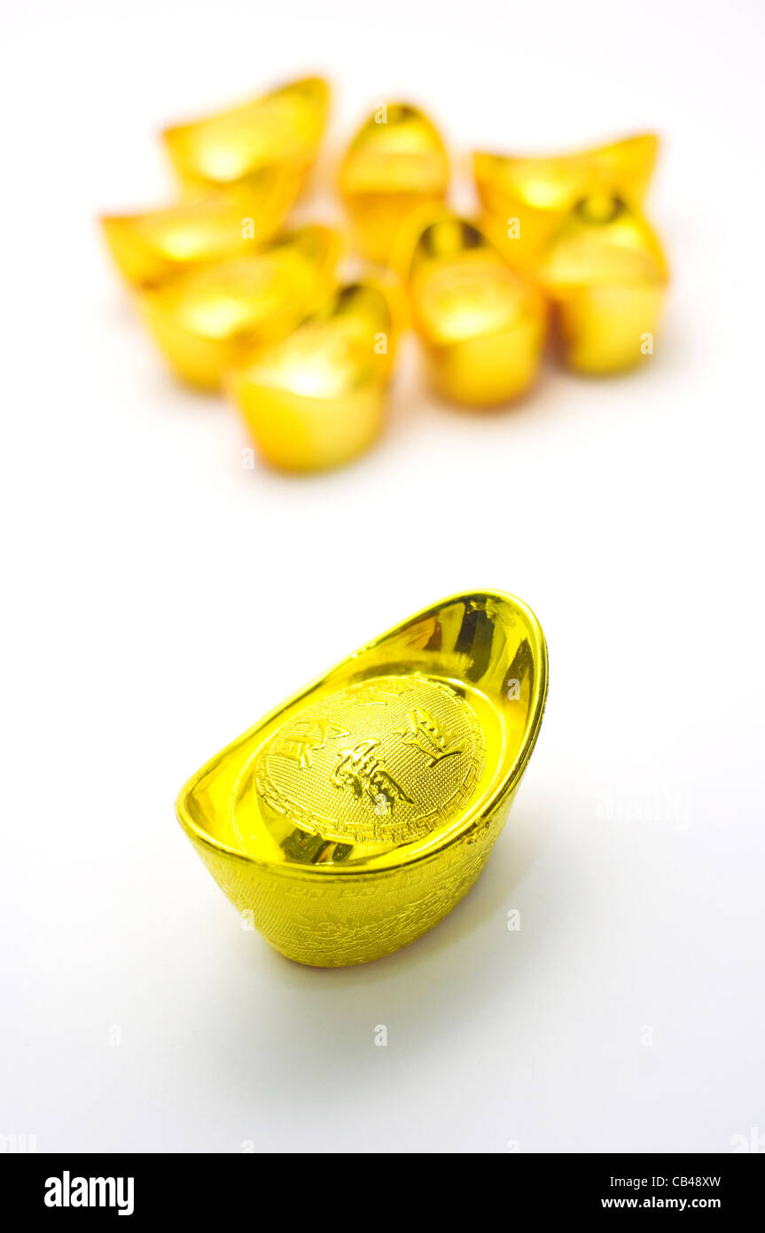 chinese gold ingots, a symbol of wealth for chinese Stock Photo - Alamy