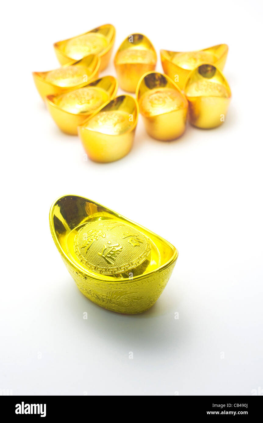 chinese gold ingots, a symbol of wealth for chinese Stock Photo - Alamy