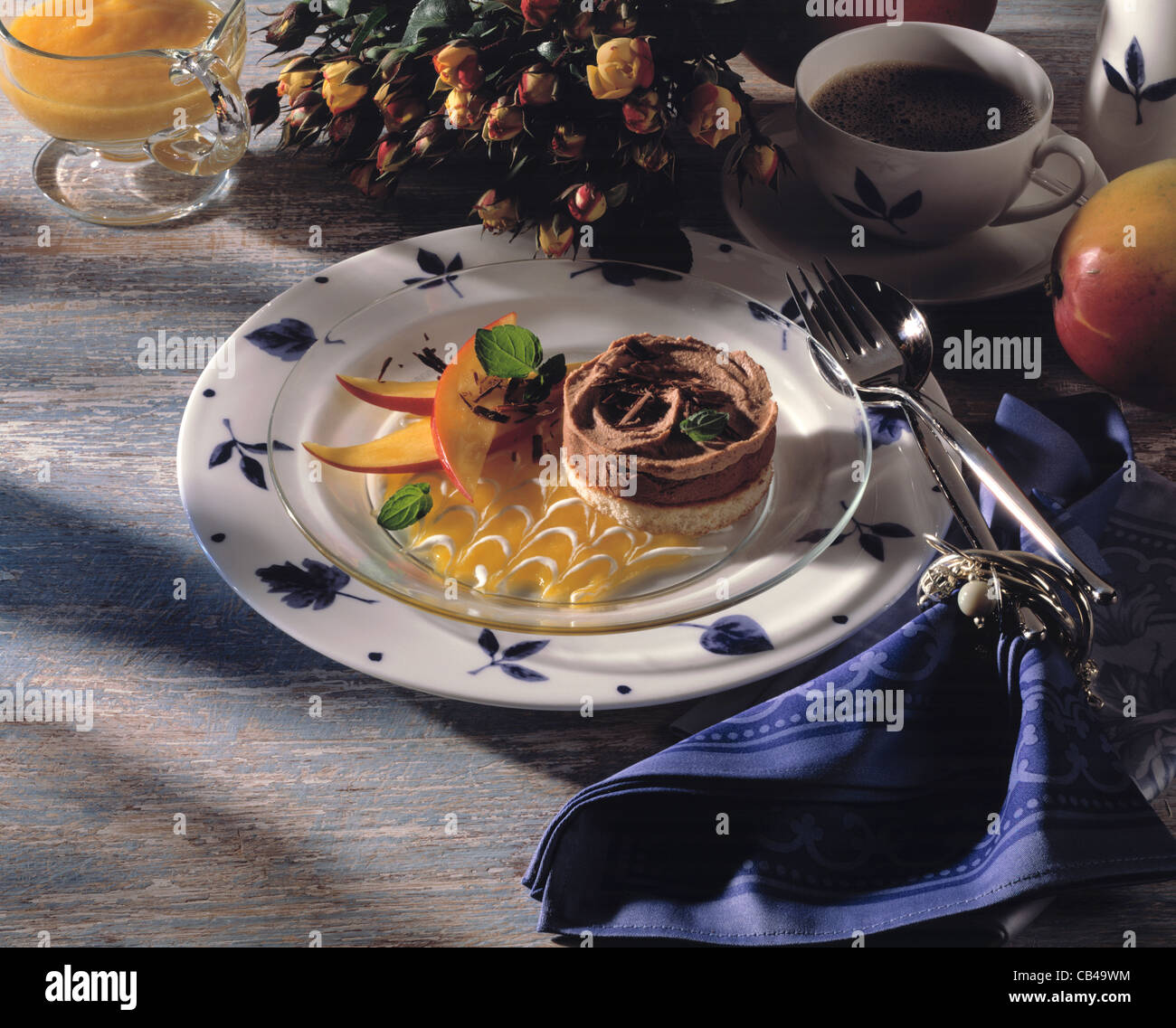 Iced choco - mousse with mango sauce Stock Photo - Alamy