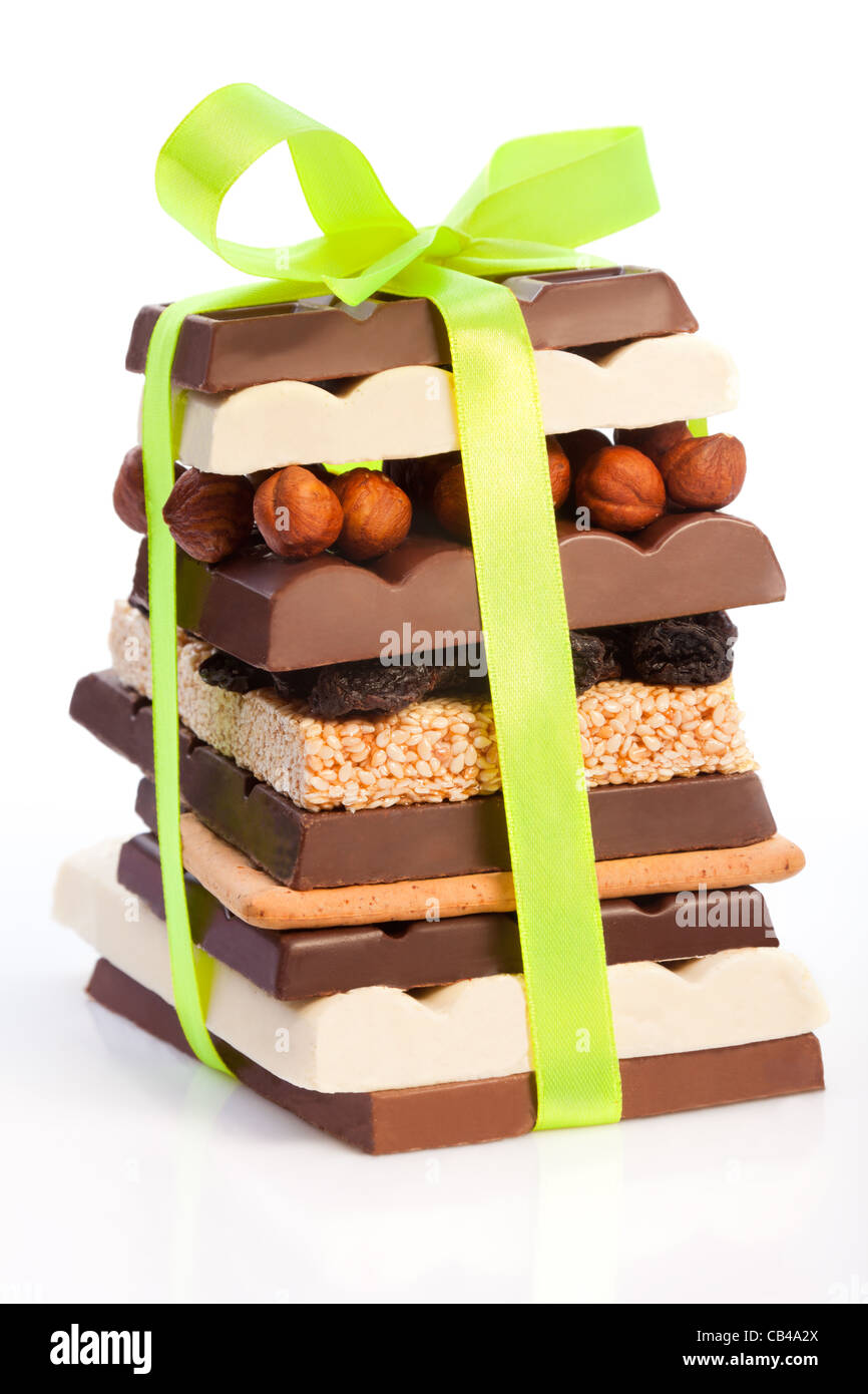Pyramid of sweets, chocolate, nuts, cookies decorated with ribbon as a ...