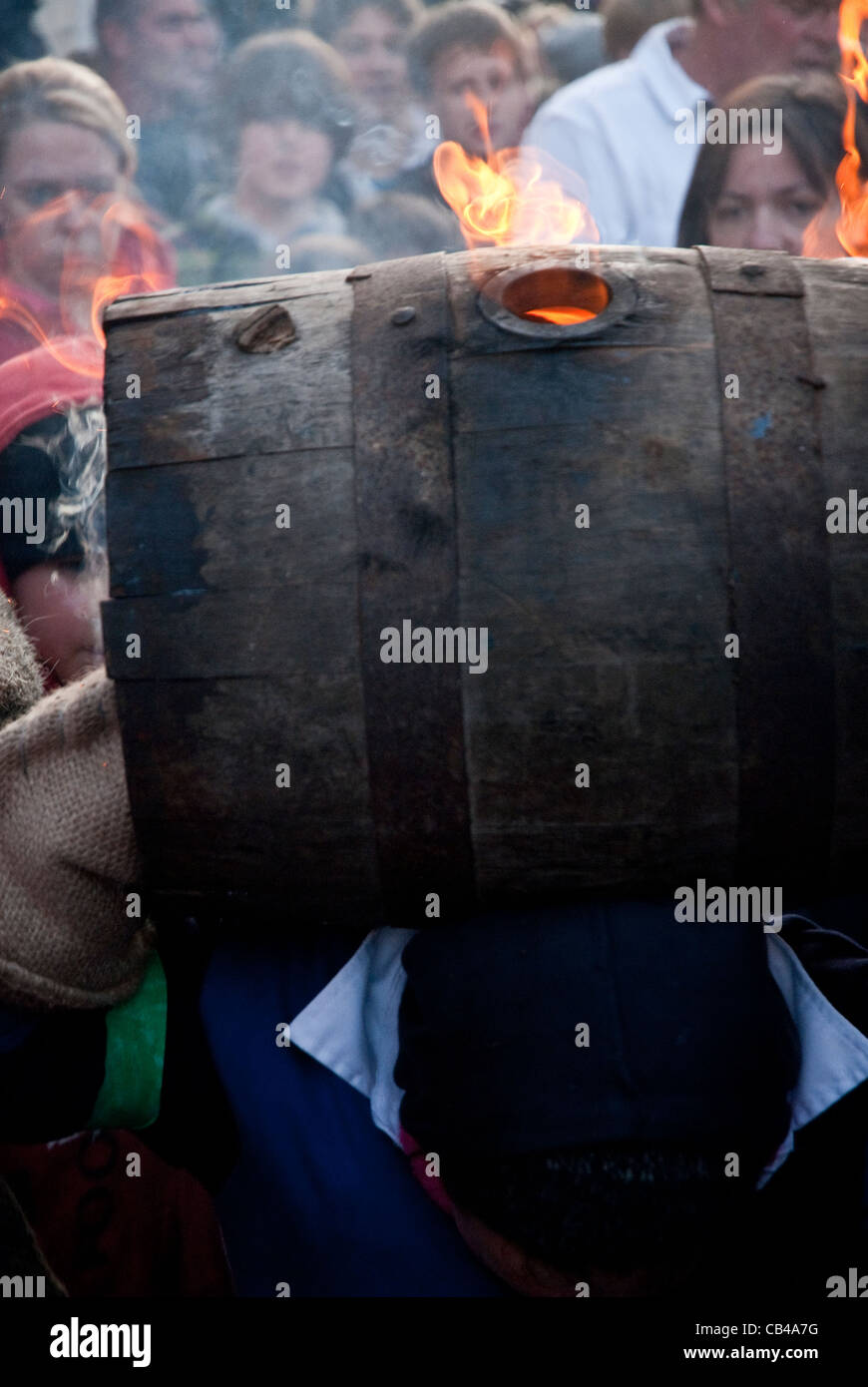 The flames burst through the barrel hole as a young barrel roller runs ...