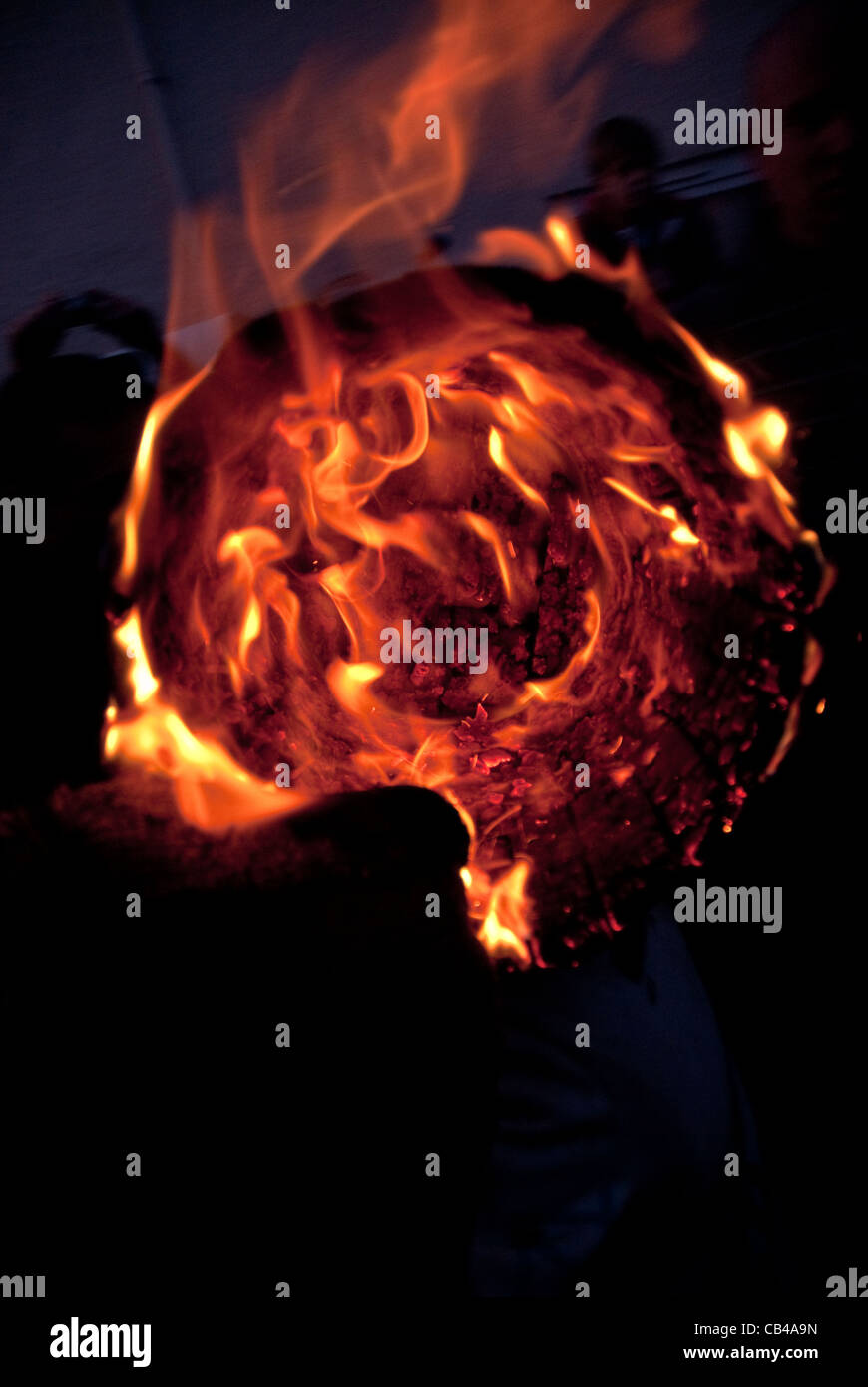 Inside a burning tar barrel as it's carried through the streets of ...