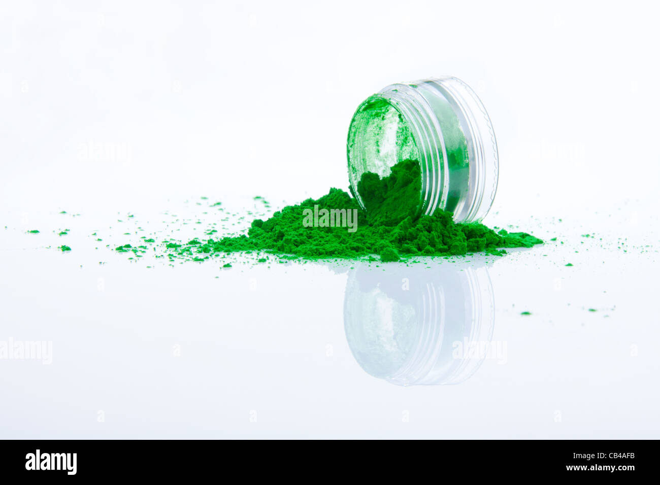 spilled green makeup powder from jar Stock Photo - Alamy