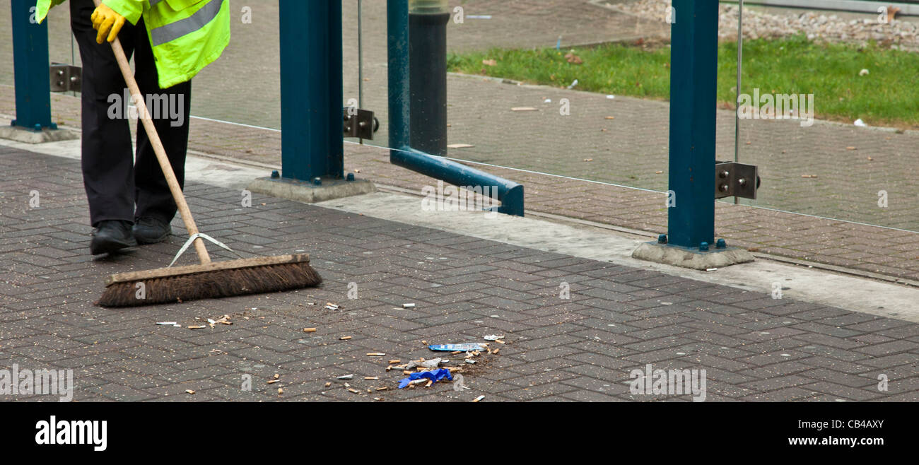 Person Sweeping Litter Stock Photo - Alamy