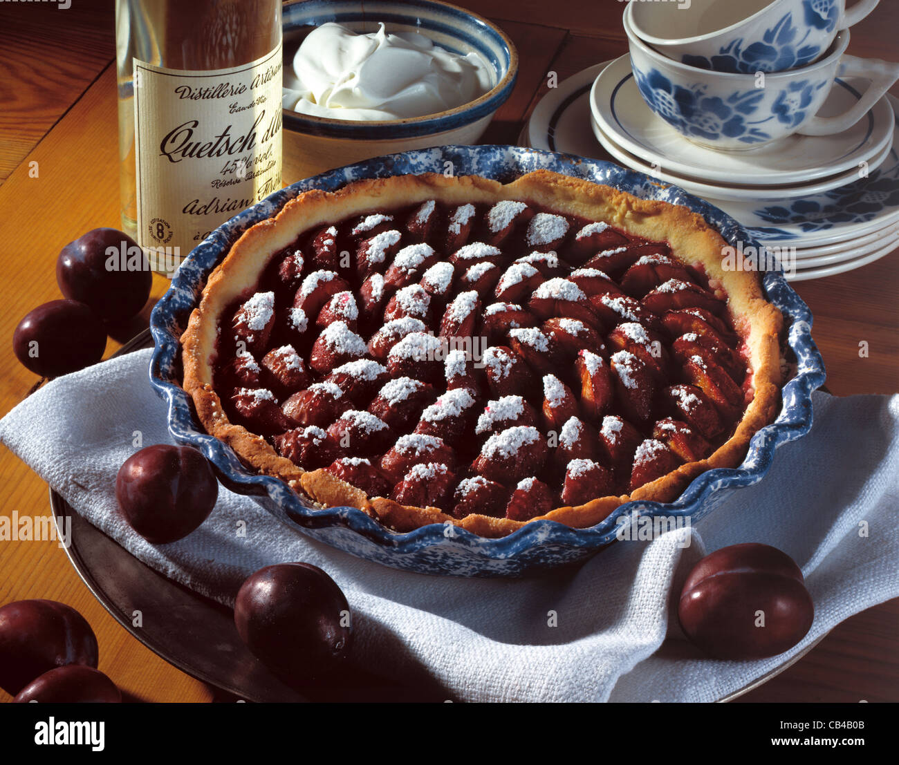 Damson cake with whipped cream Stock Photo - Alamy