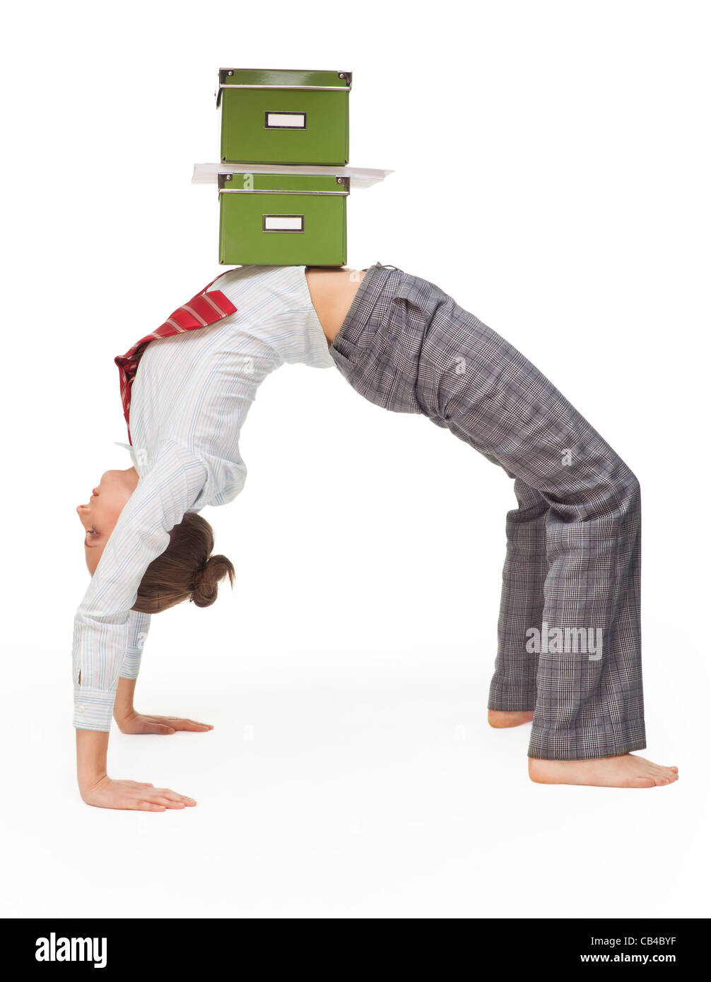 Business woman in flexible pose (bridge pose) with boxes with document ...