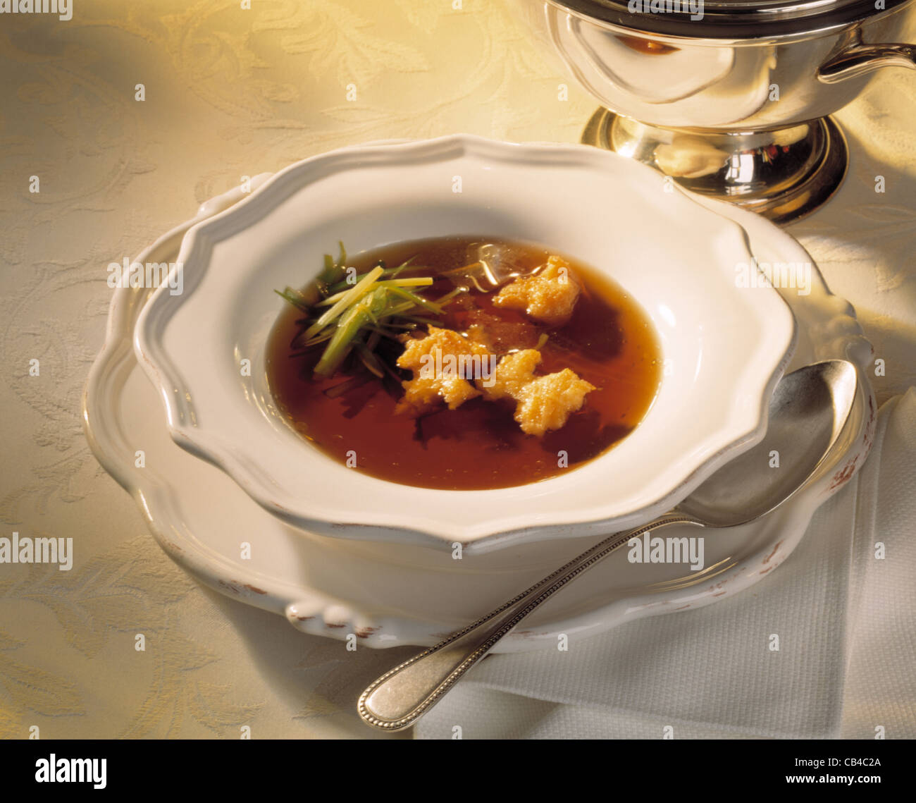 Beef bouillon with cheese pastry Stock Photo - Alamy