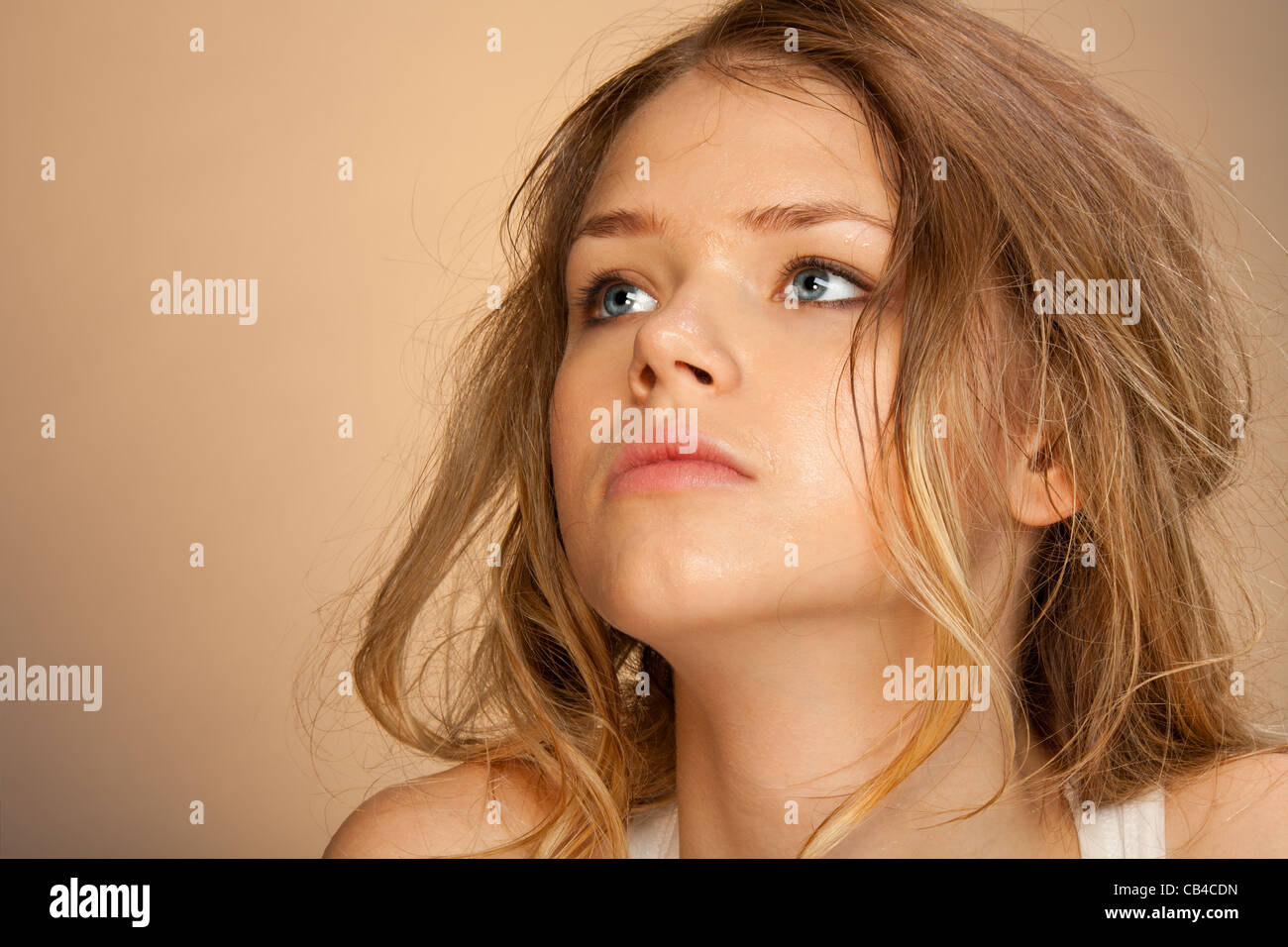 Portrait of beautiful girl with tired face expression Stock Photo - Alamy