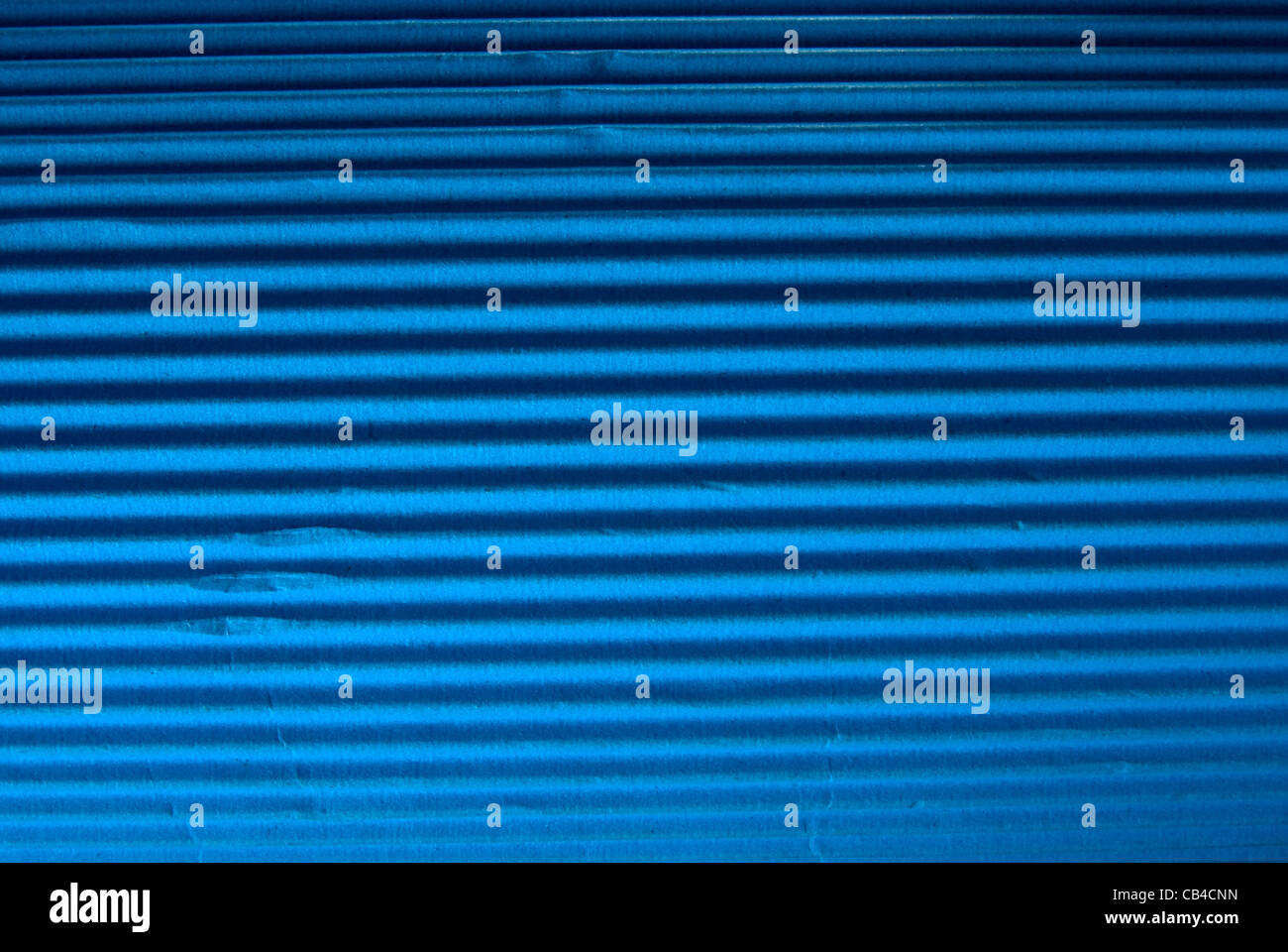 Vintage blue corrugated cardboard macro close up. Useful as background ...