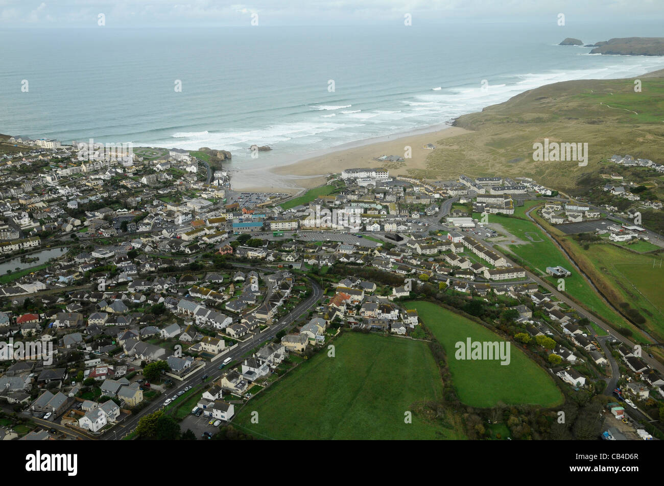The small town of Perranporth sits behind the cliffs at the south end ...