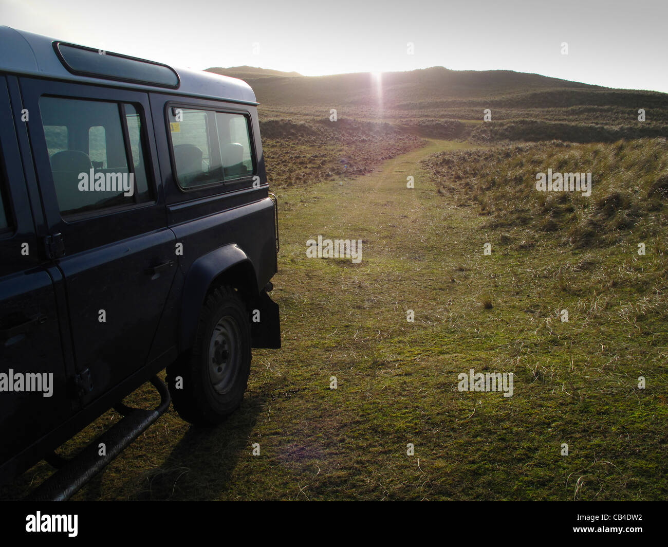Land Rover parked on grass track on moorland Stock Photo - Alamy