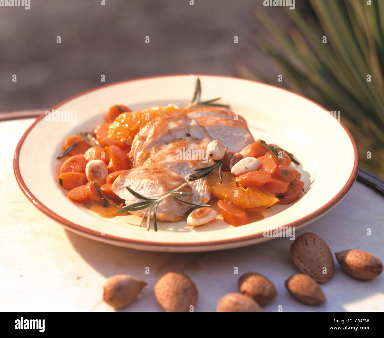 Chicken fillet with carrot - almond vegetables Stock Photo - Alamy