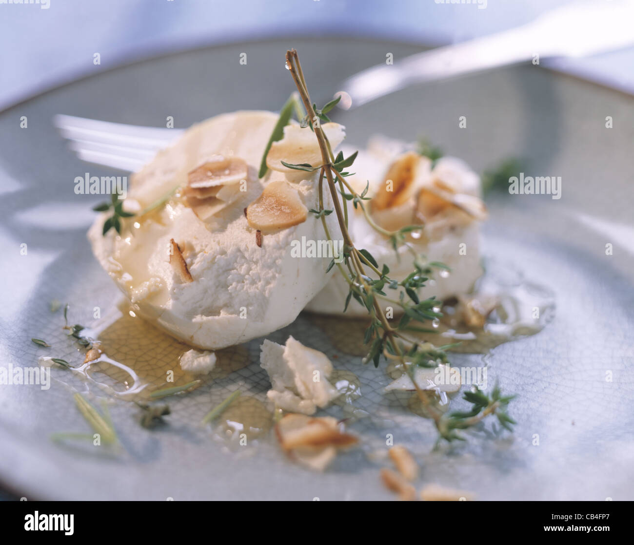Goat cheese with honey and roasted nuts Stock Photo - Alamy
