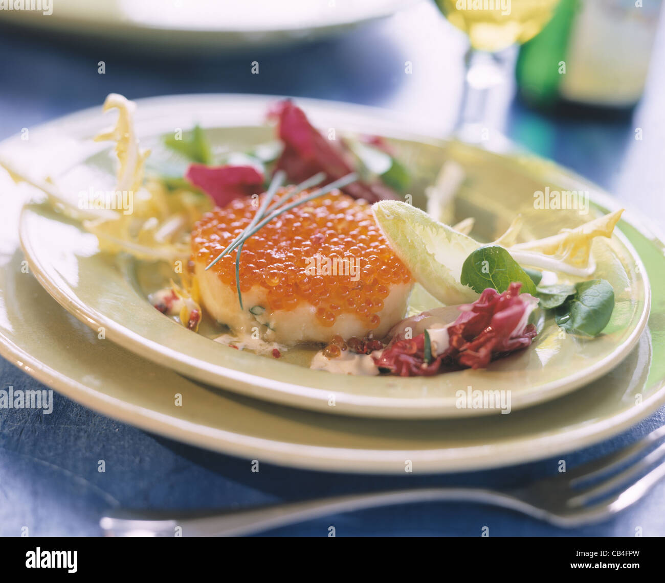 Tartlets of potato in the skin with trout caviar Stock Photo - Alamy