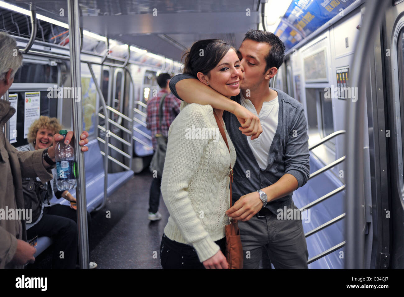 Couple kissing on tube hi-res stock photography and images - Alamy