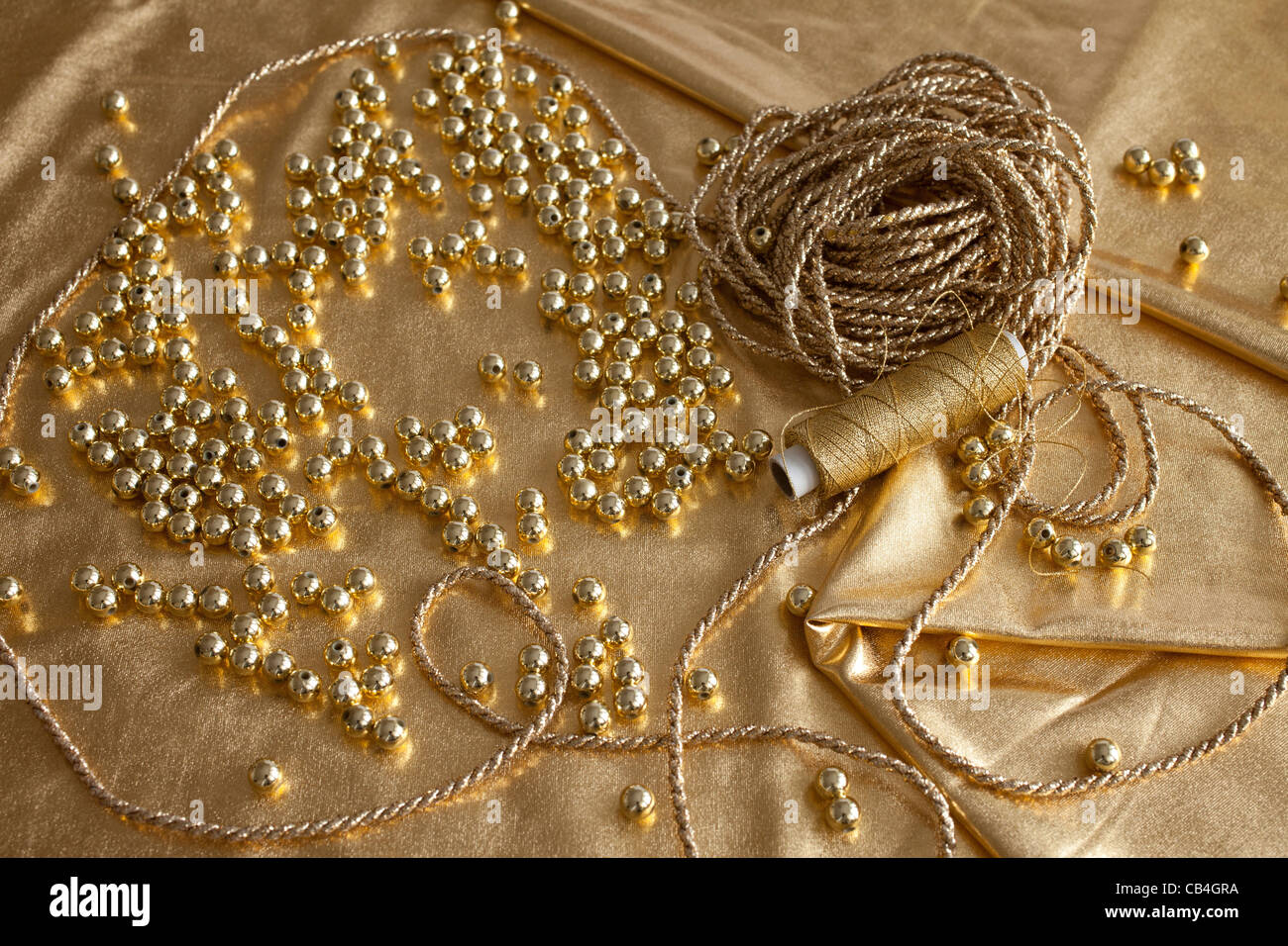 Gold thread on fabric hi-res stock photography and images - Alamy