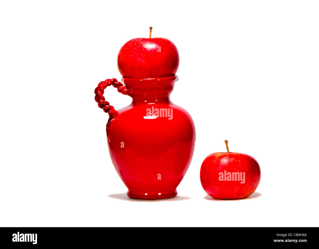 two apple and red jug isolated on white Stock Photo - Alamy