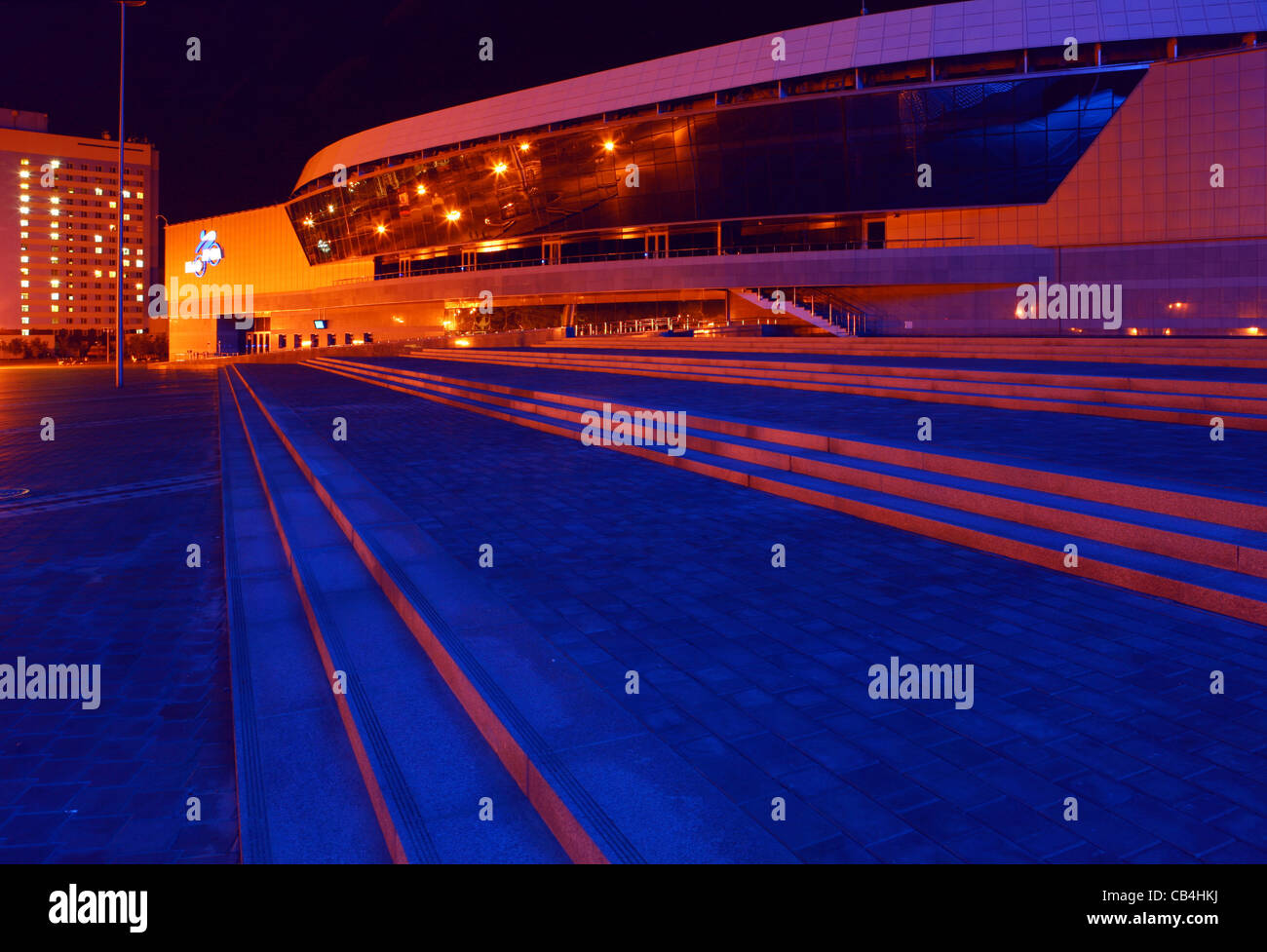 Buildings of modern architecture at night illuminated with night ...