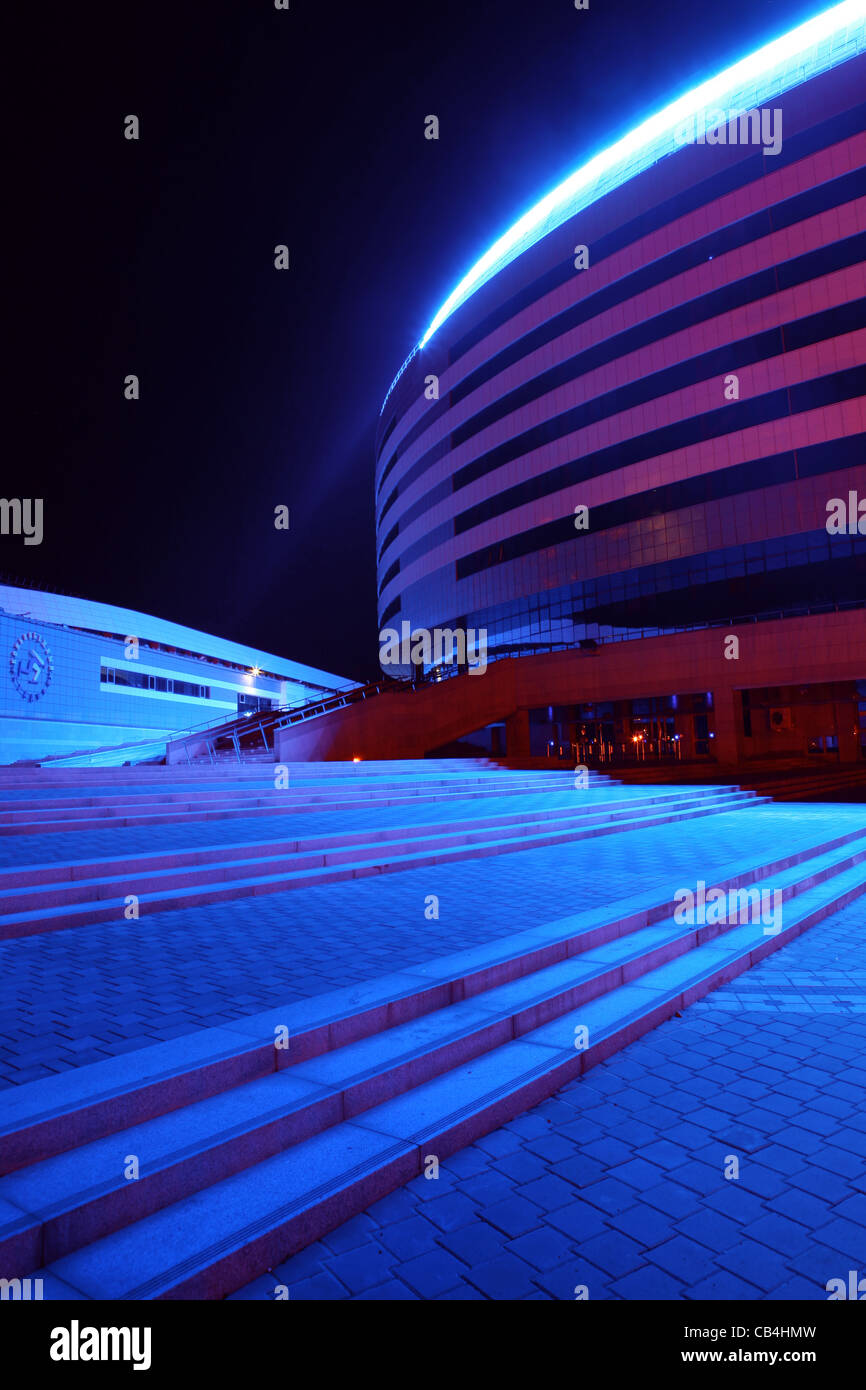Buildings of modern architecture at night illuminated with night ...