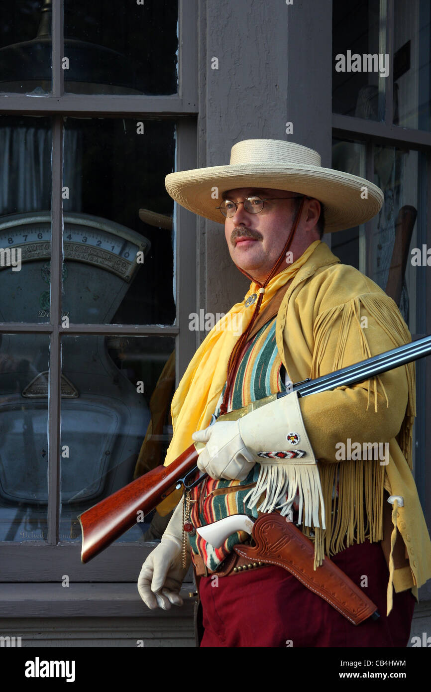 A southwestern cowboy standing in front of an old store Stock Photo - Alamy