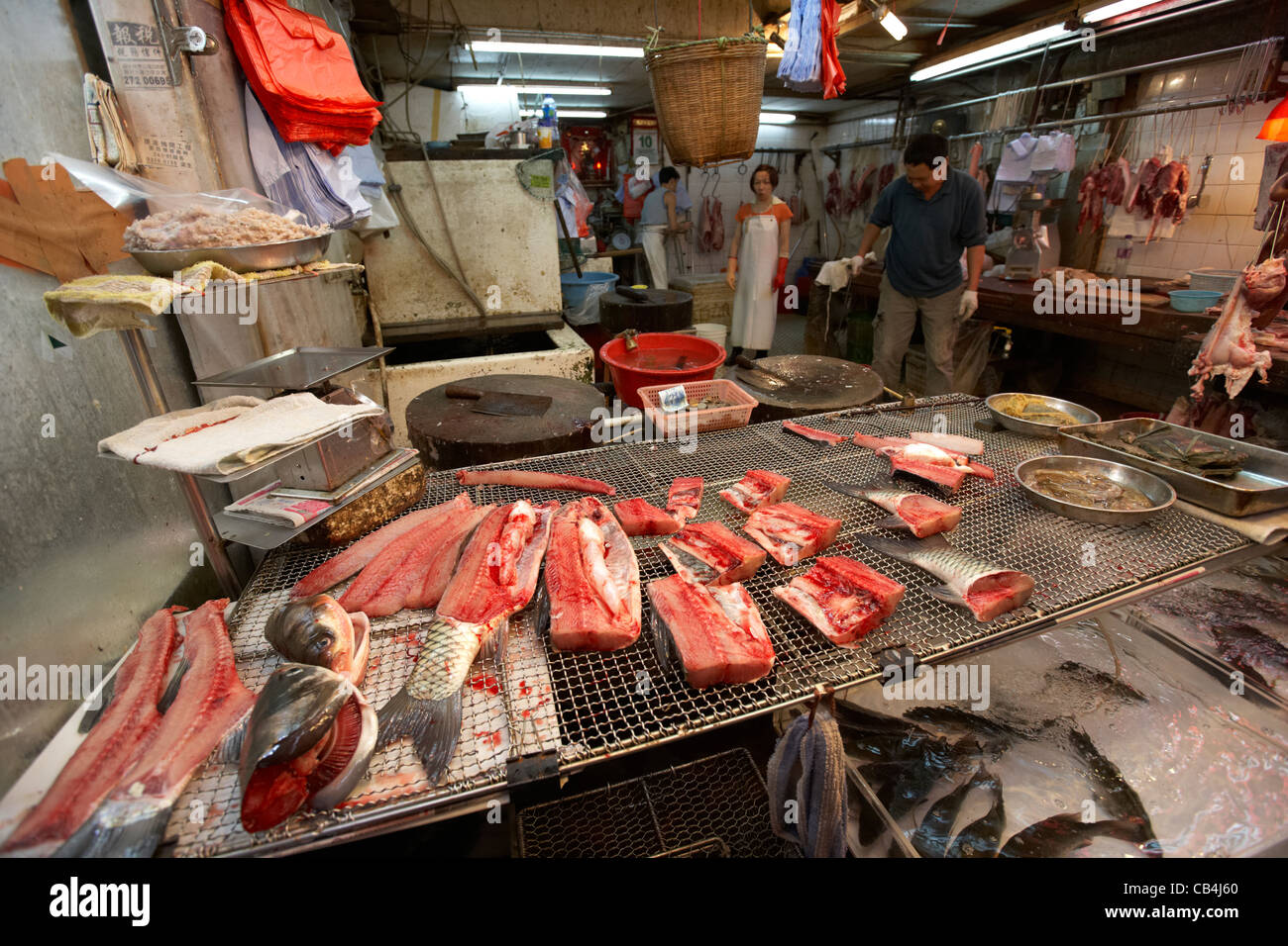 fresh fish recently cut up in a street fishmongers at a food market ...