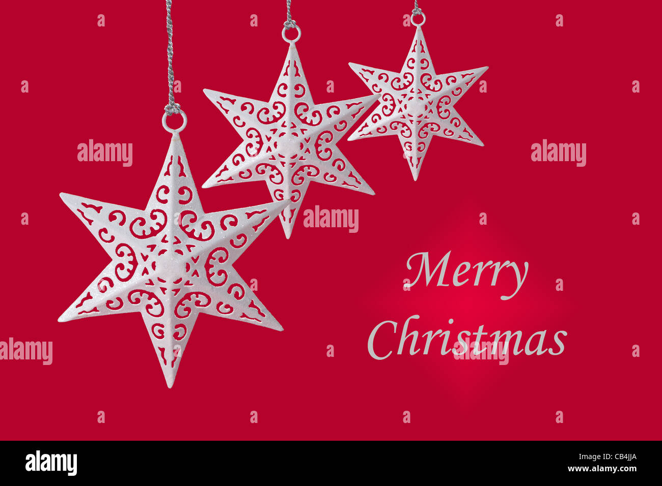 White Christmas star ornament on red background, with Merry Christmas ...