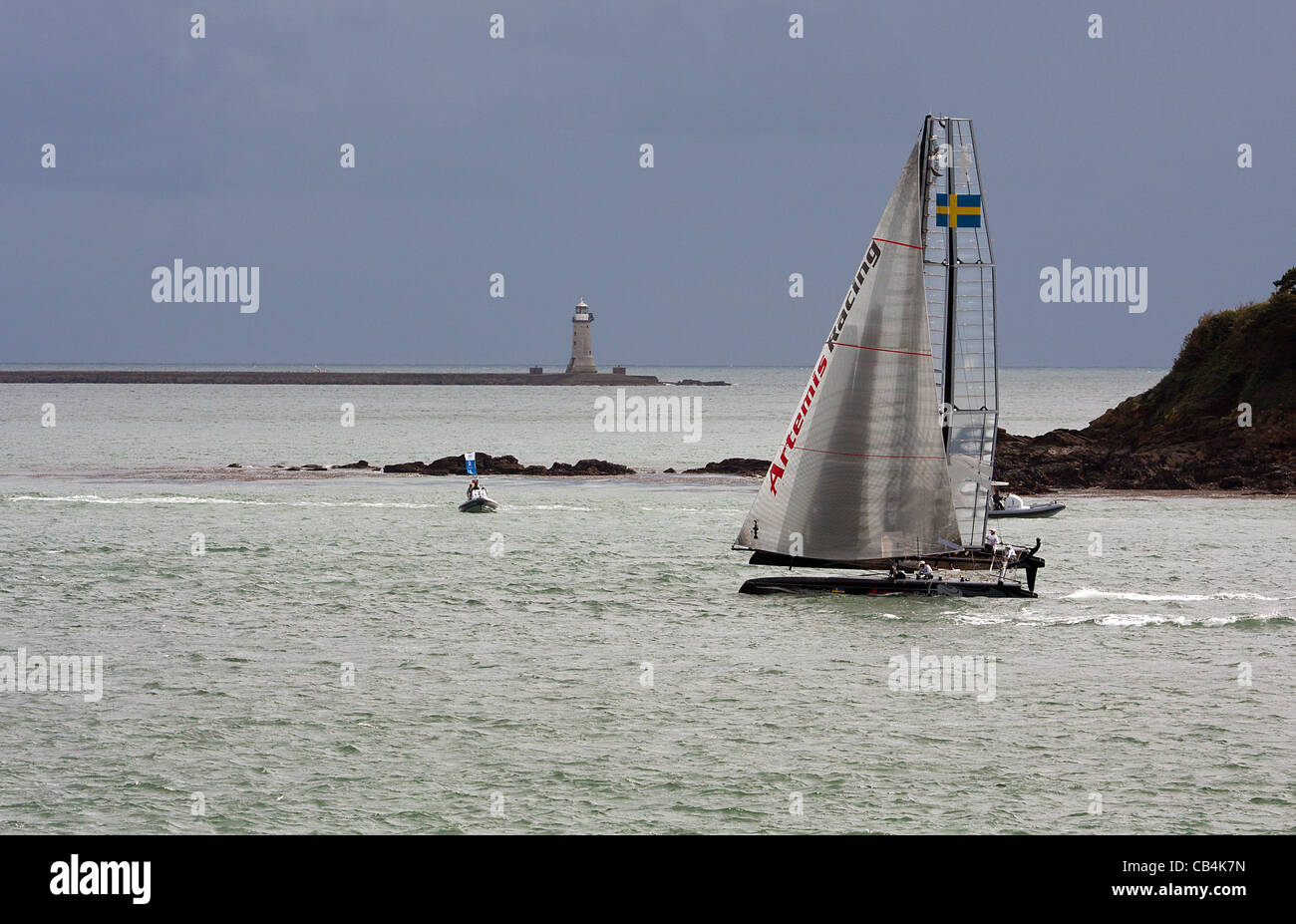 America's Cup catamaran in Plymouth Sound with Breakwater in the ...