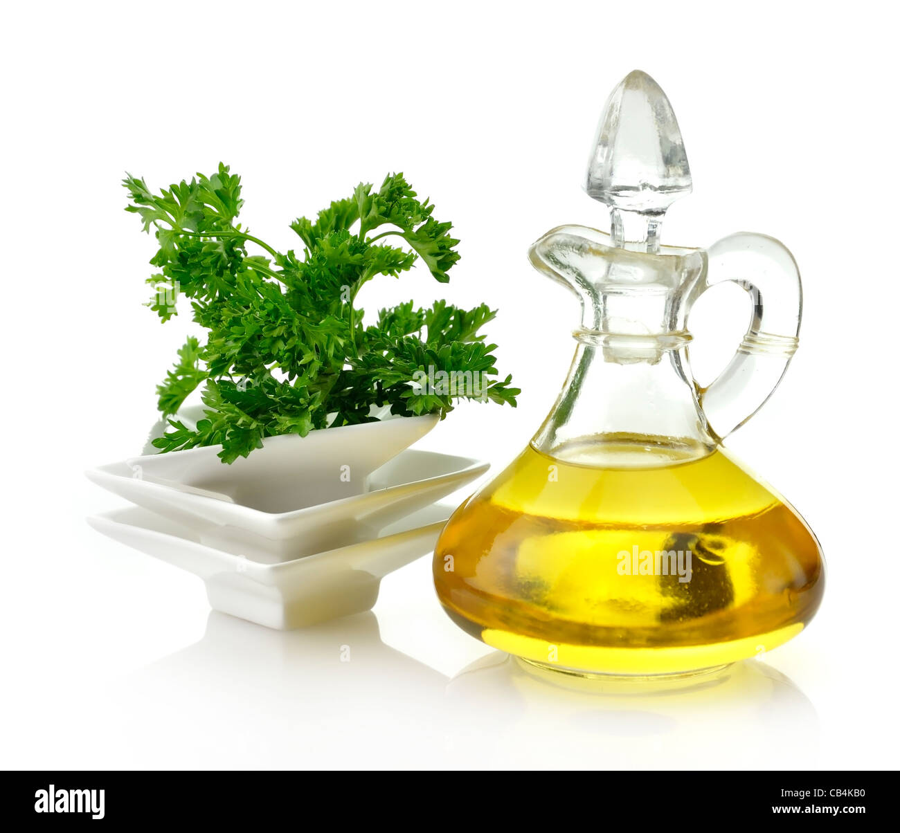 Cooking Oil And Parsley On White Background Stock Photo - Alamy