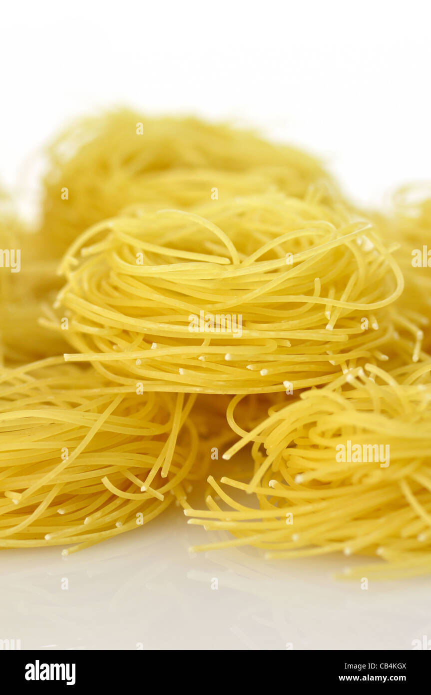 Raw pasta nests ,close up shot for background Stock Photo - Alamy