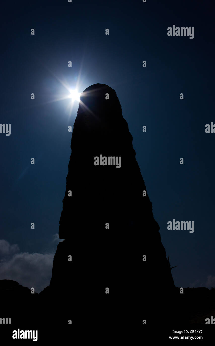 A sunburst behind the silhouette of an ancient Obelisk at the High ...