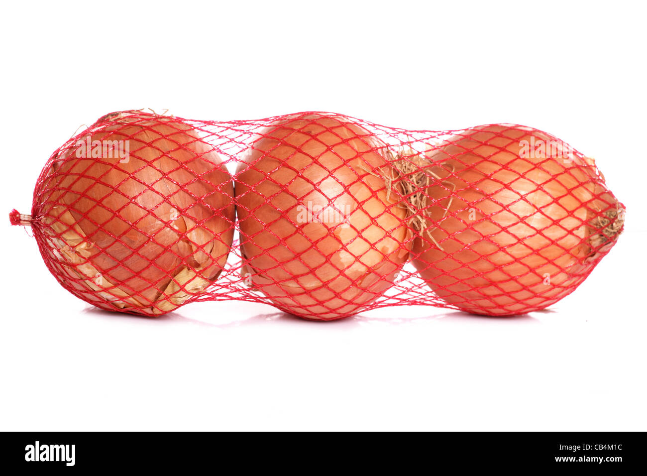 three onions on a white background Stock Photo - Alamy