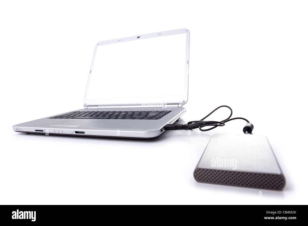 a silver laptop with an external disk with a white screen (isolated on ...