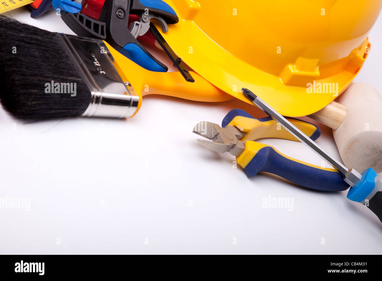 a mix of construction tools over a white background Stock Photo - Alamy