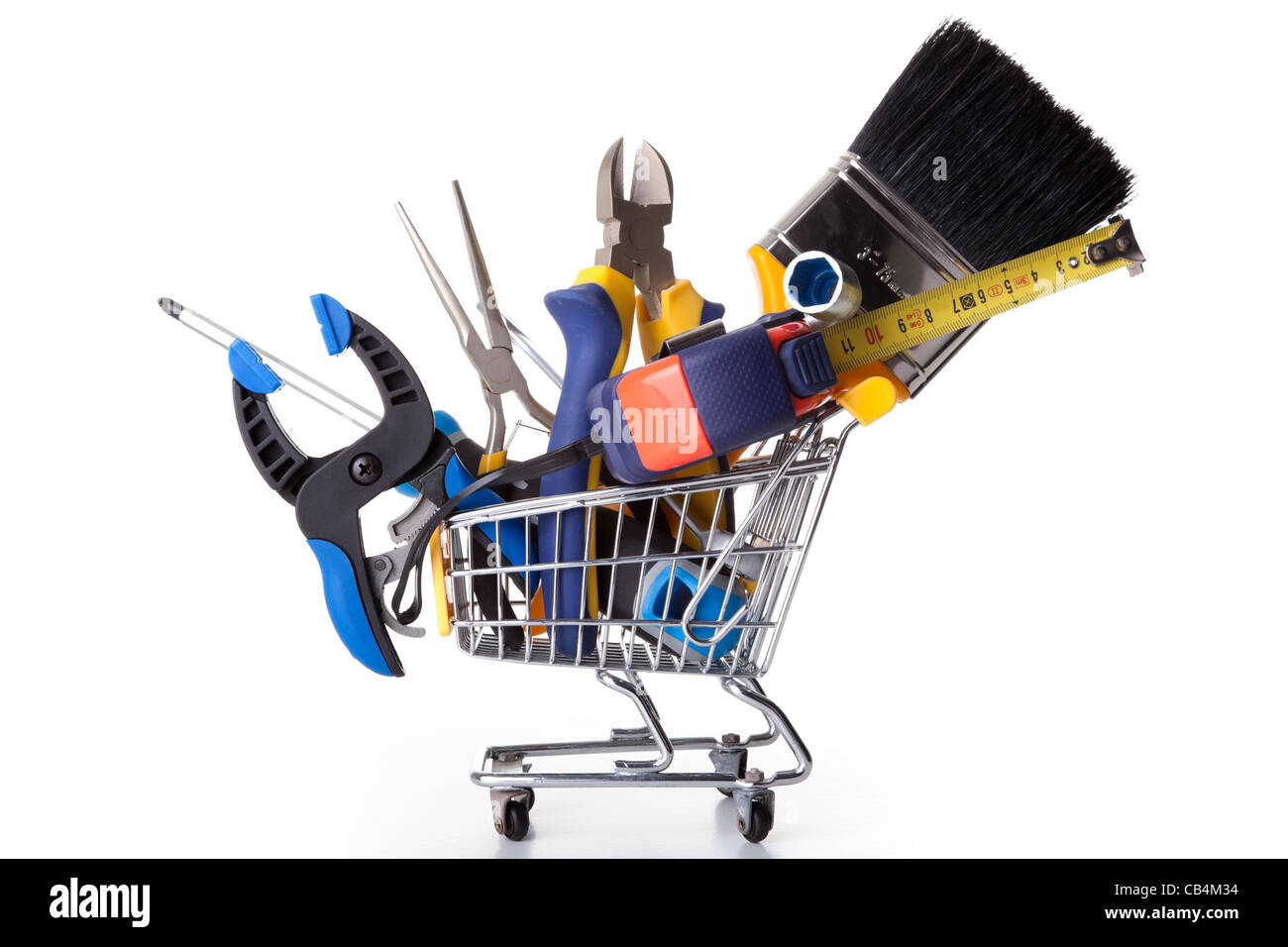 mix of construction tools inside a shopping cart (isolated on white ...