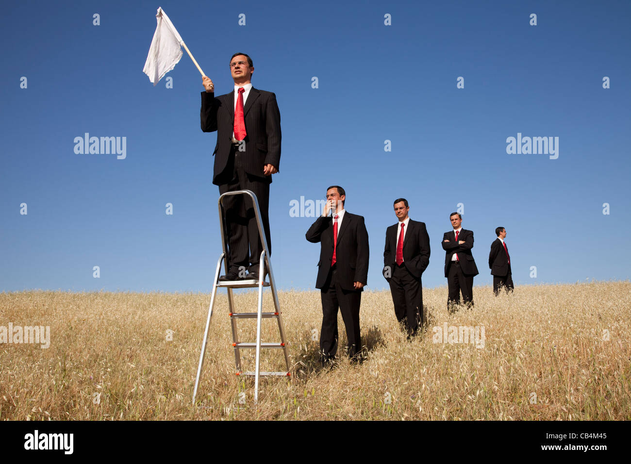 a group of businessman in the field getting in line for there time to ...