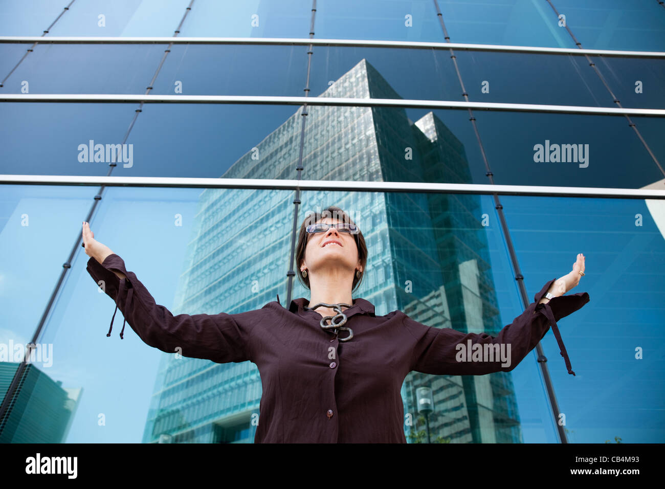 successful businesswoman looking up next to her office building Stock ...