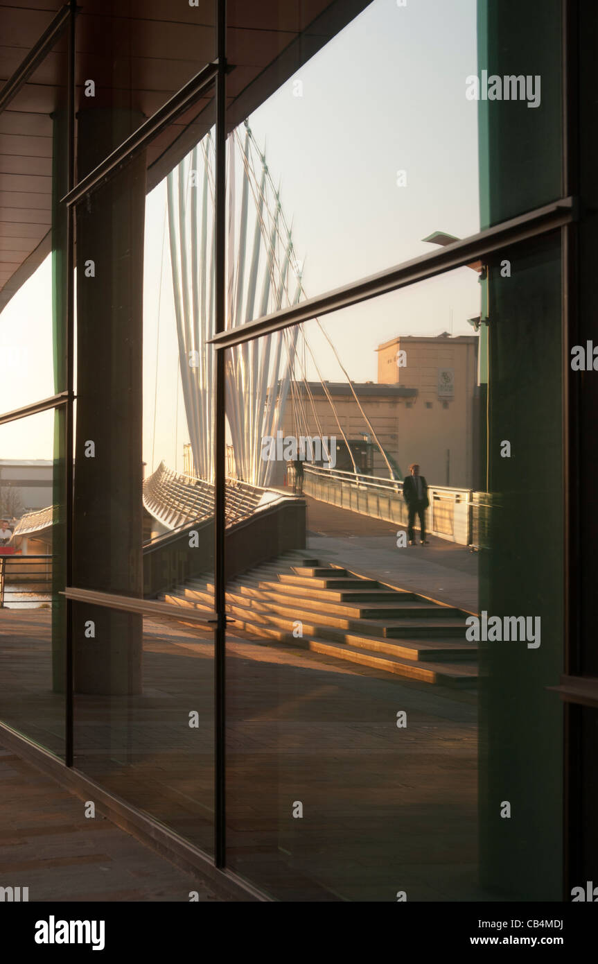 The MediaCityUK swing footbridge reflected in the windows of Bridge ...