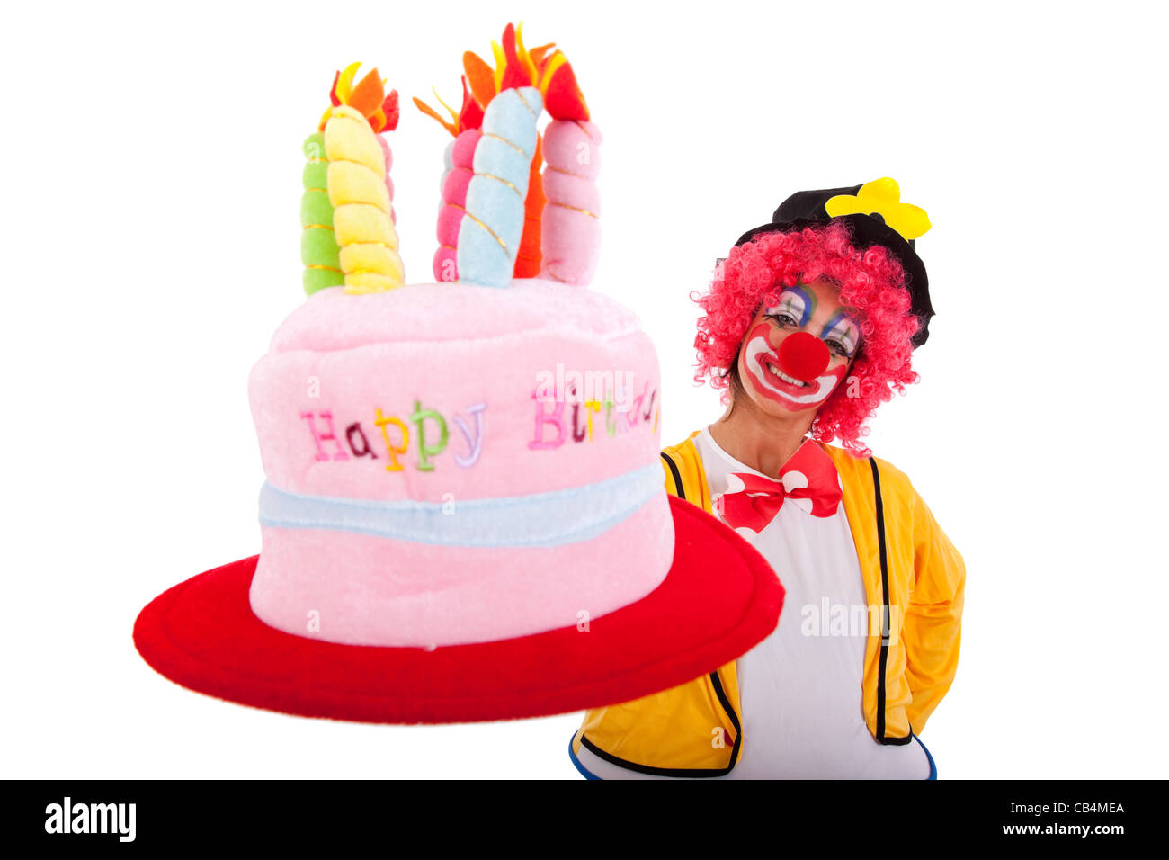 funny clown holding a birthday cake hat (isolated on white Stock Photo ...