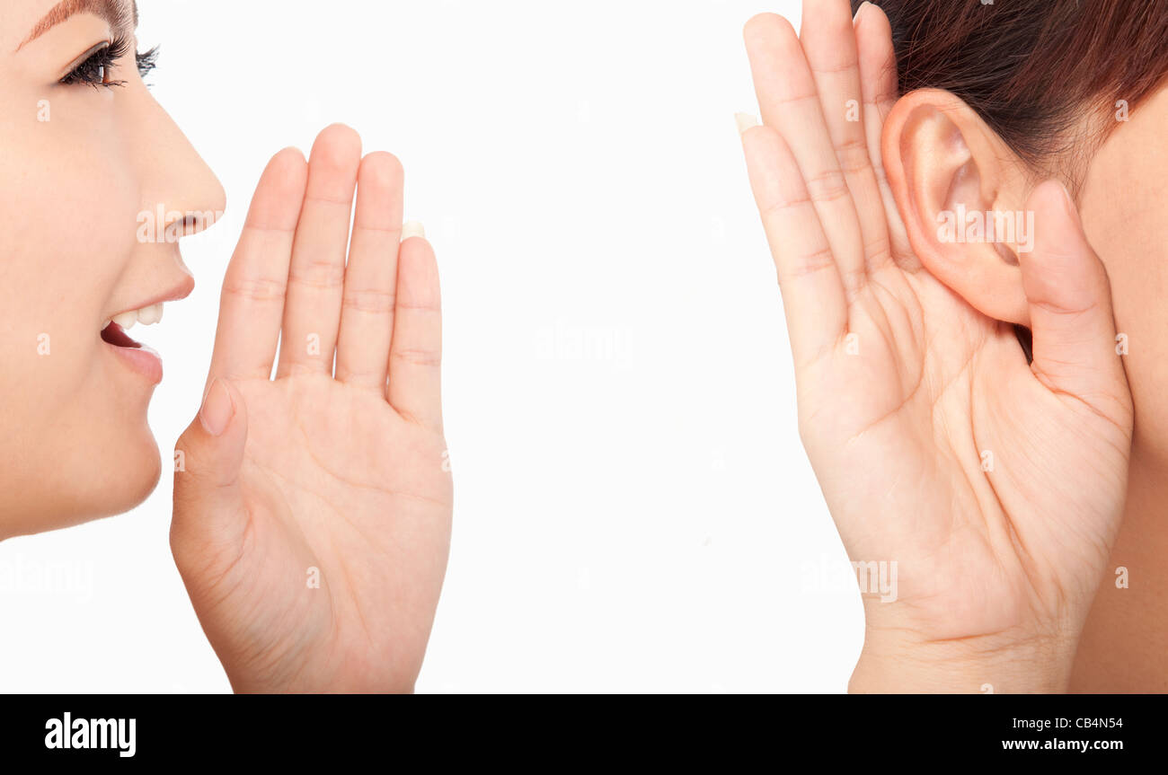 women talking and listening to gossip Stock Photo - Alamy